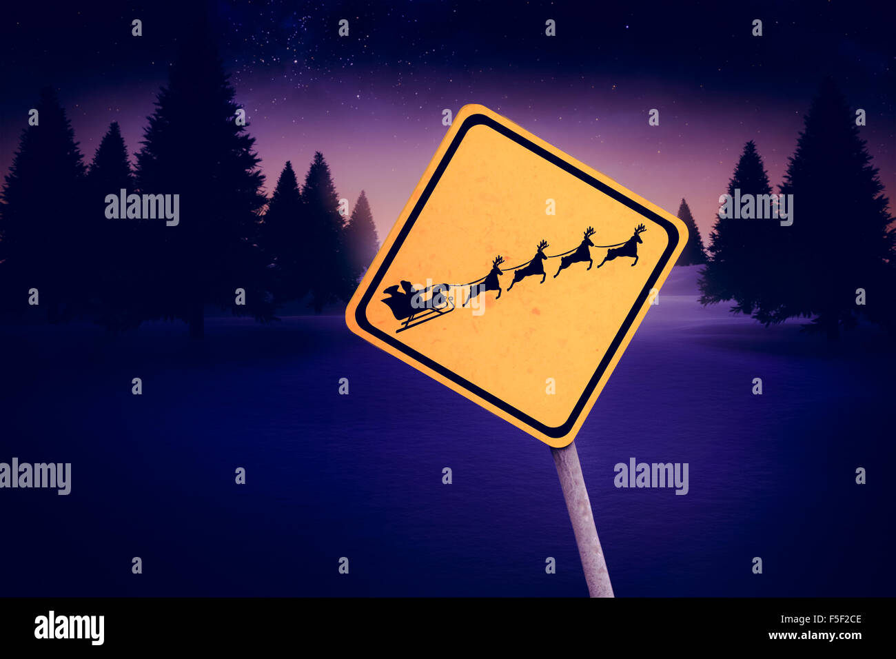 Composite image of christmas road sign Stock Photo - Alamy