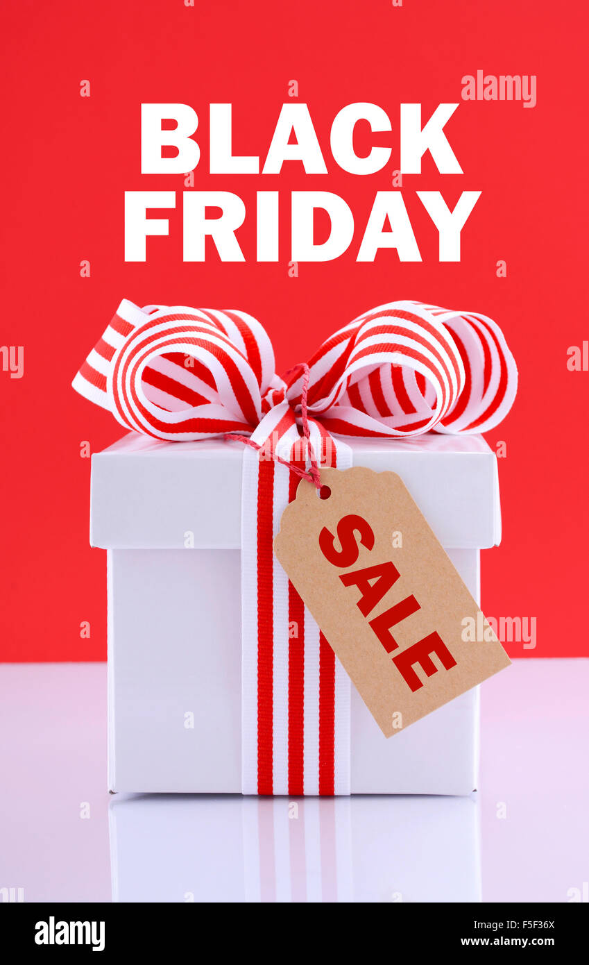 Black Friday red and white sales promotion gift box on white reflective ...