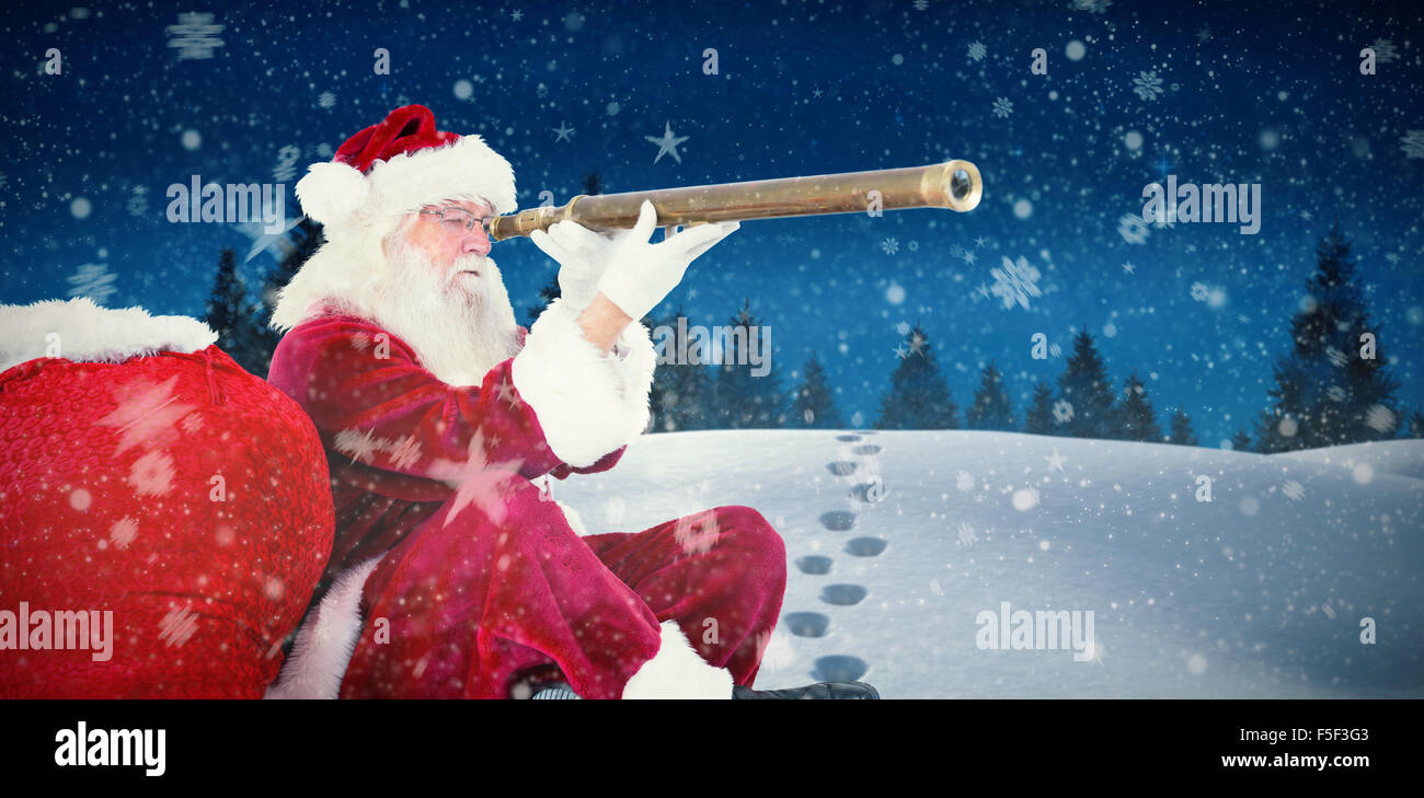 Composite image of santa claus looking through telescope Stock Photo ...