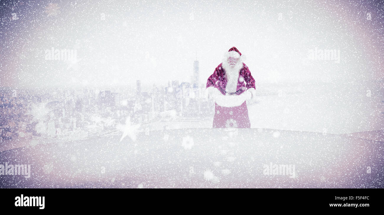 Composite image of santa open his red bag Stock Photo - Alamy