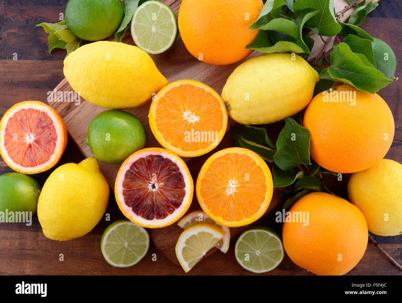 Mixed citrus fruit including navel and blood oranges, lemons and limes ...