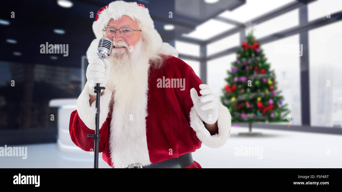 Composite image of santa claus is singing christmas songs Stock Photo ...