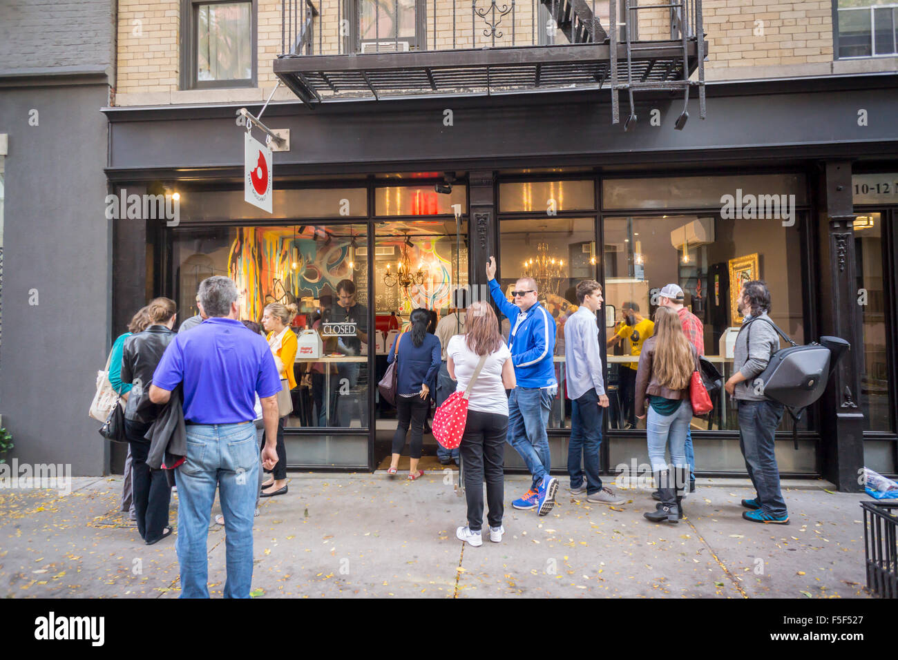 Doughnut lovers line up outside The Doughnut Project, a new donut shop ...