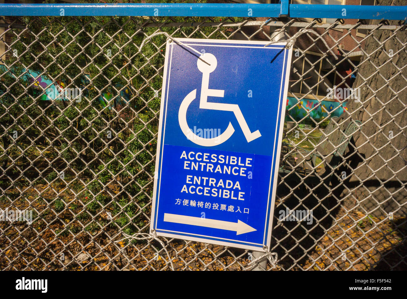 Trilingual sign directing handicapped voters to the accessible entrance ...