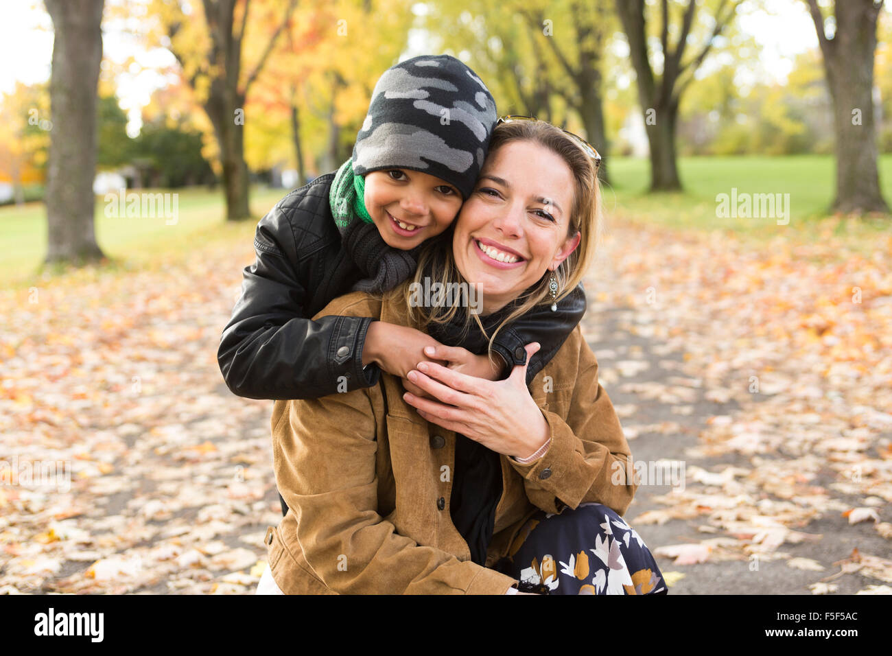 Happy family having fun on beautiful autumn day Stock Photo - Alamy