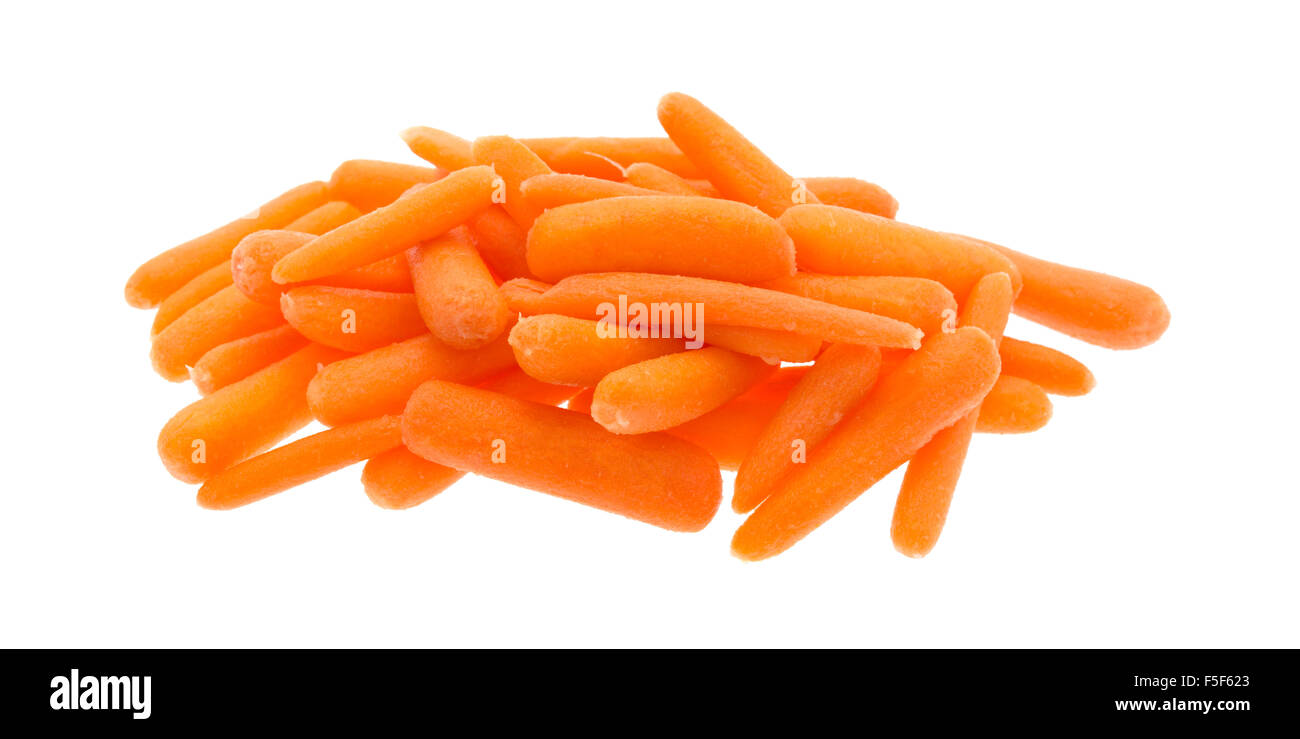 A group of organic small baby carrots isolated on a white background ...