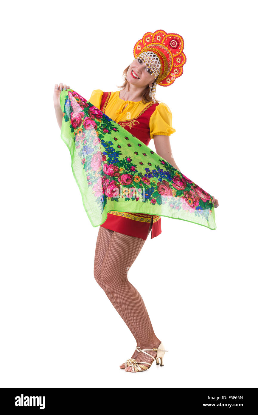 Young woman wearing a folk costumes dancing. Isolated on white in full ...
