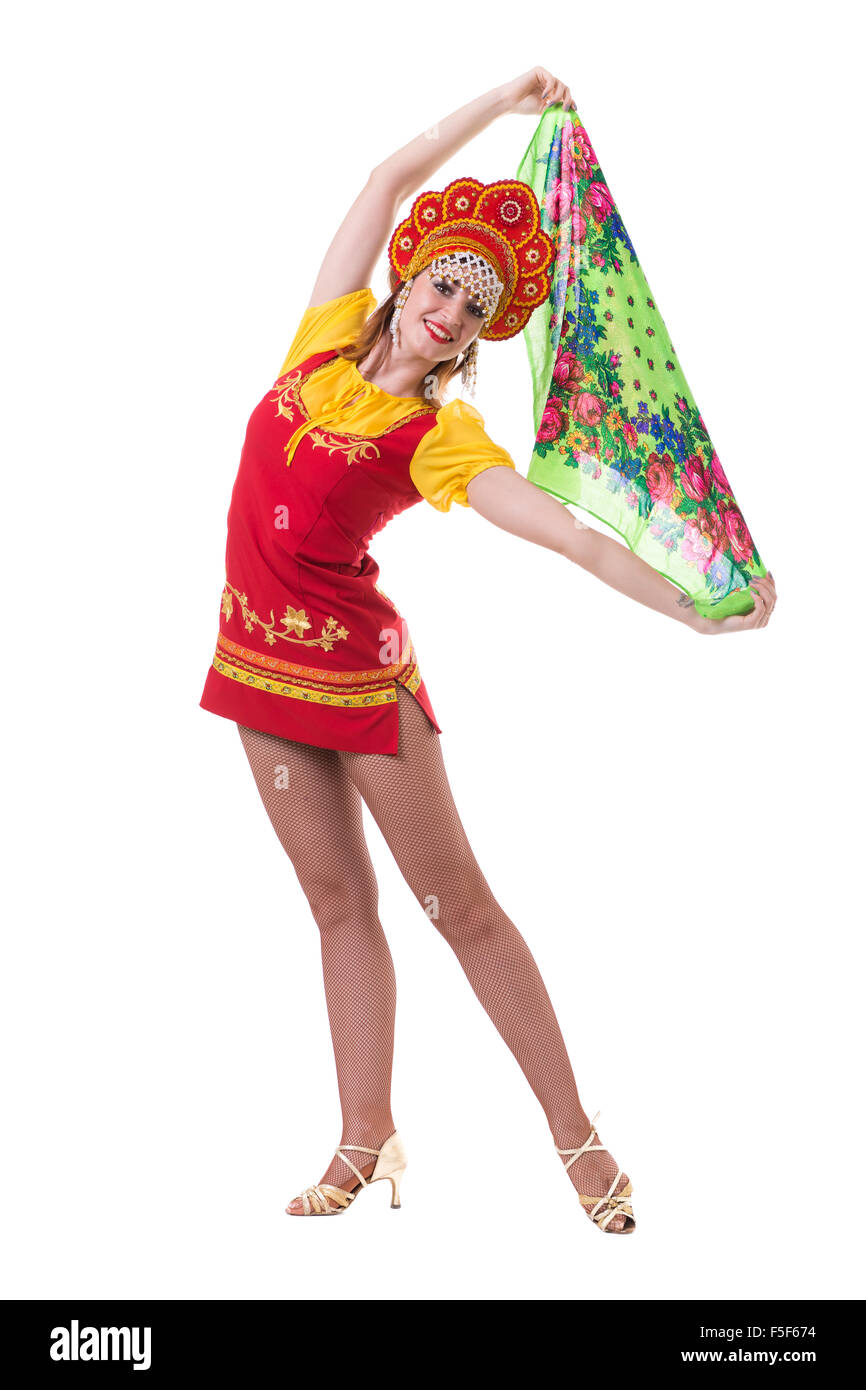 Young woman wearing a folk costumes dancing. Isolated on white in full ...