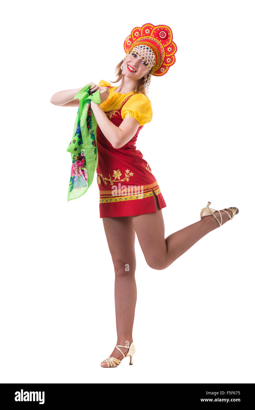 Young woman wearing a folk costumes dancing. Isolated on white in full ...