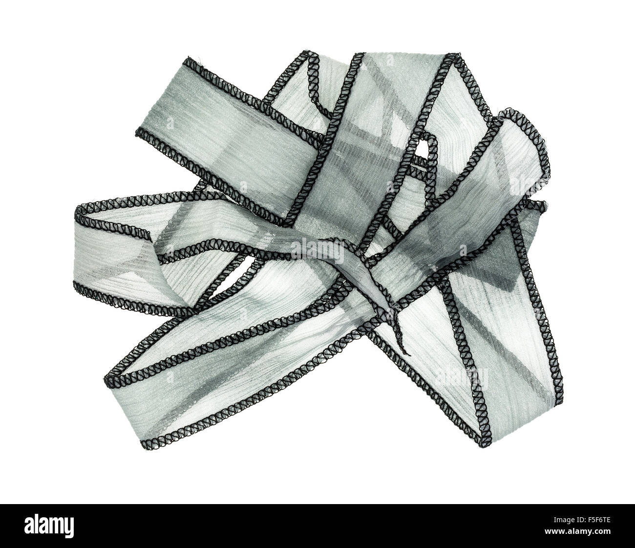 A small length of sheer gray ribbon cloth with a black binding stitch ...