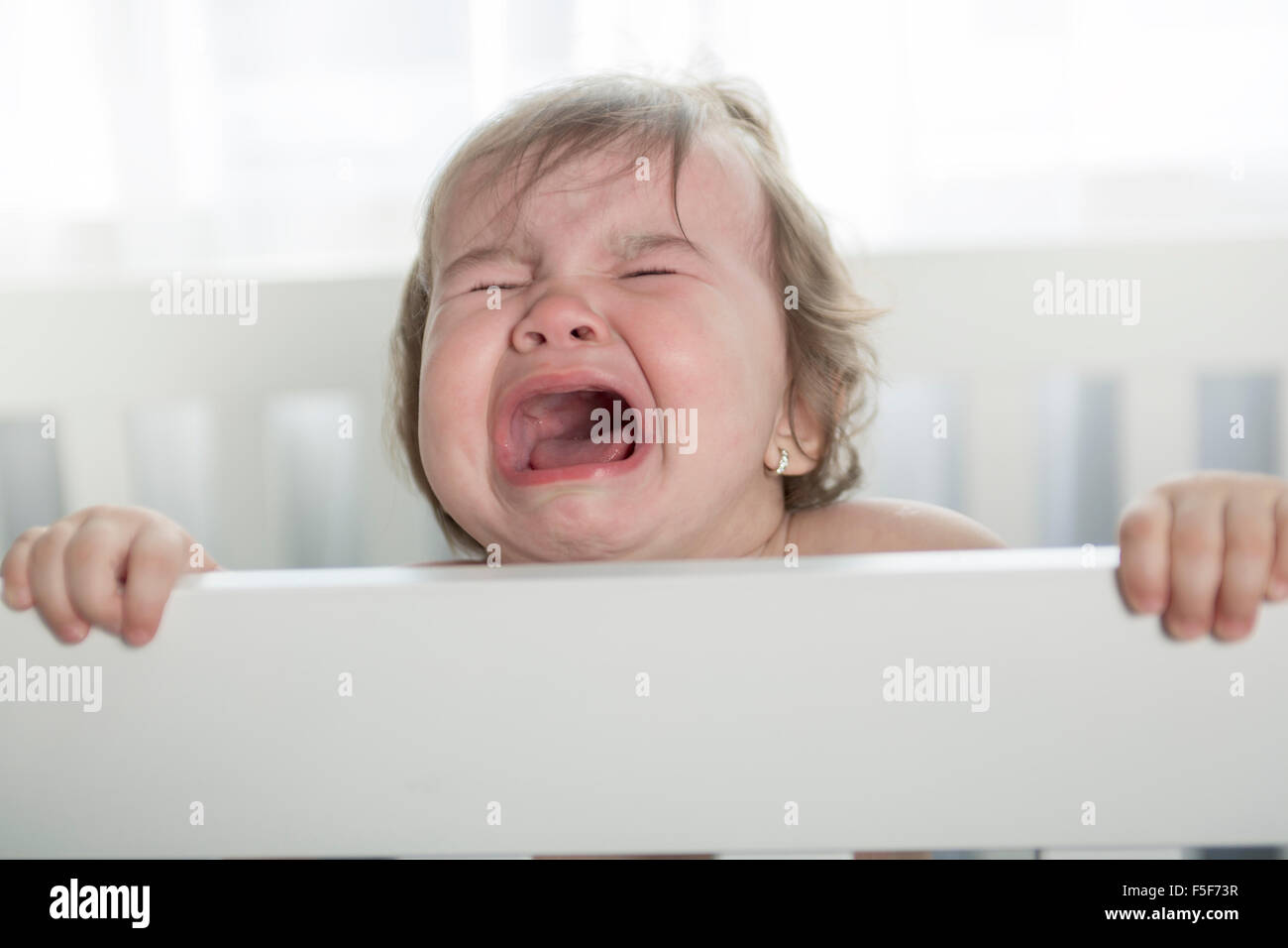 Sad baby face hi-res stock photography and images - Alamy