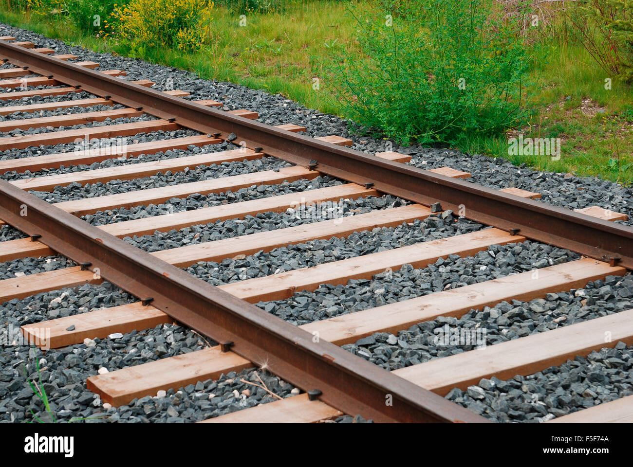 The photo of rails and sleepers on the ground Stock Photo - Alamy