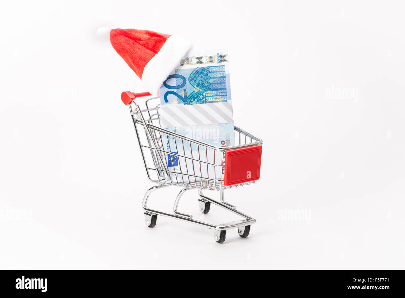 Caddy for shopping with money stack on white background Stock Photo - Alamy