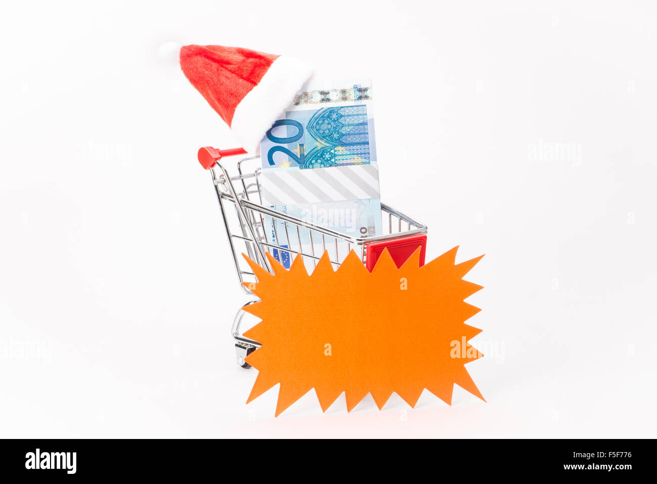 Caddy for shopping with money stack on white background Stock Photo - Alamy