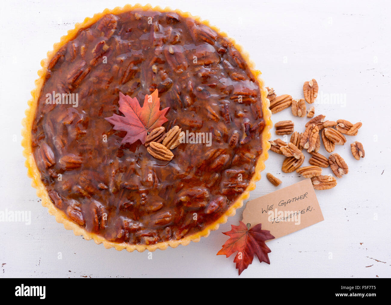 Traditional Thanksgiving Pecan Pie on rustic white wood table with We ...