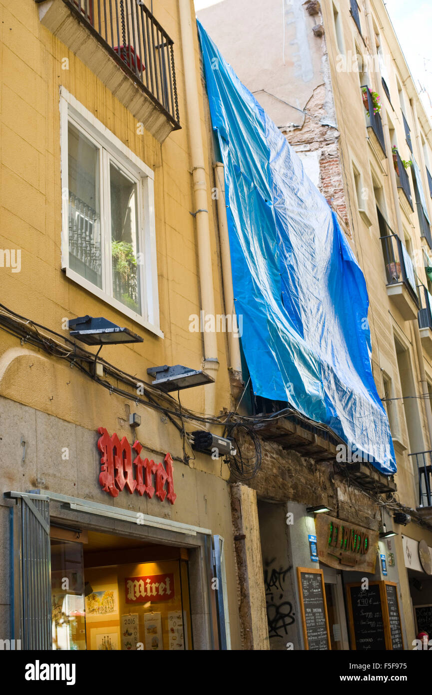 Blue plastic sheet covering building work on street in Barcelona ...