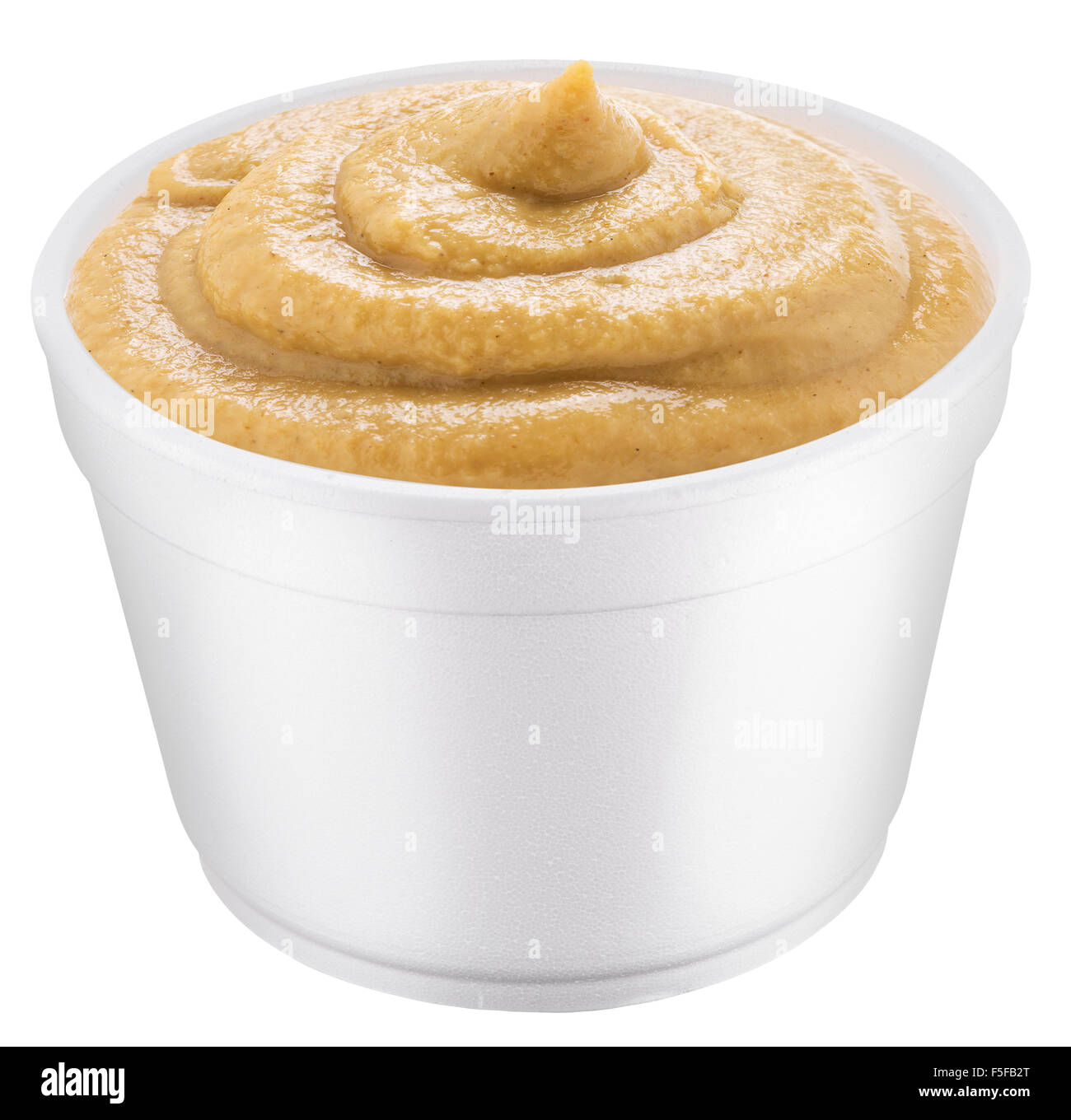 Mustard sauce in the polystyrene cup. File contains clipping paths ...