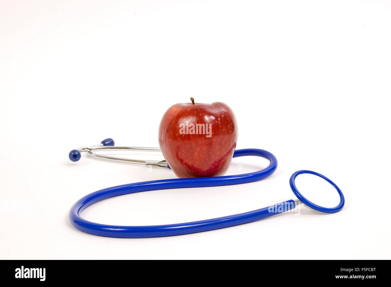 A Stethoscope and Apple on a white background Stock Photo - Alamy