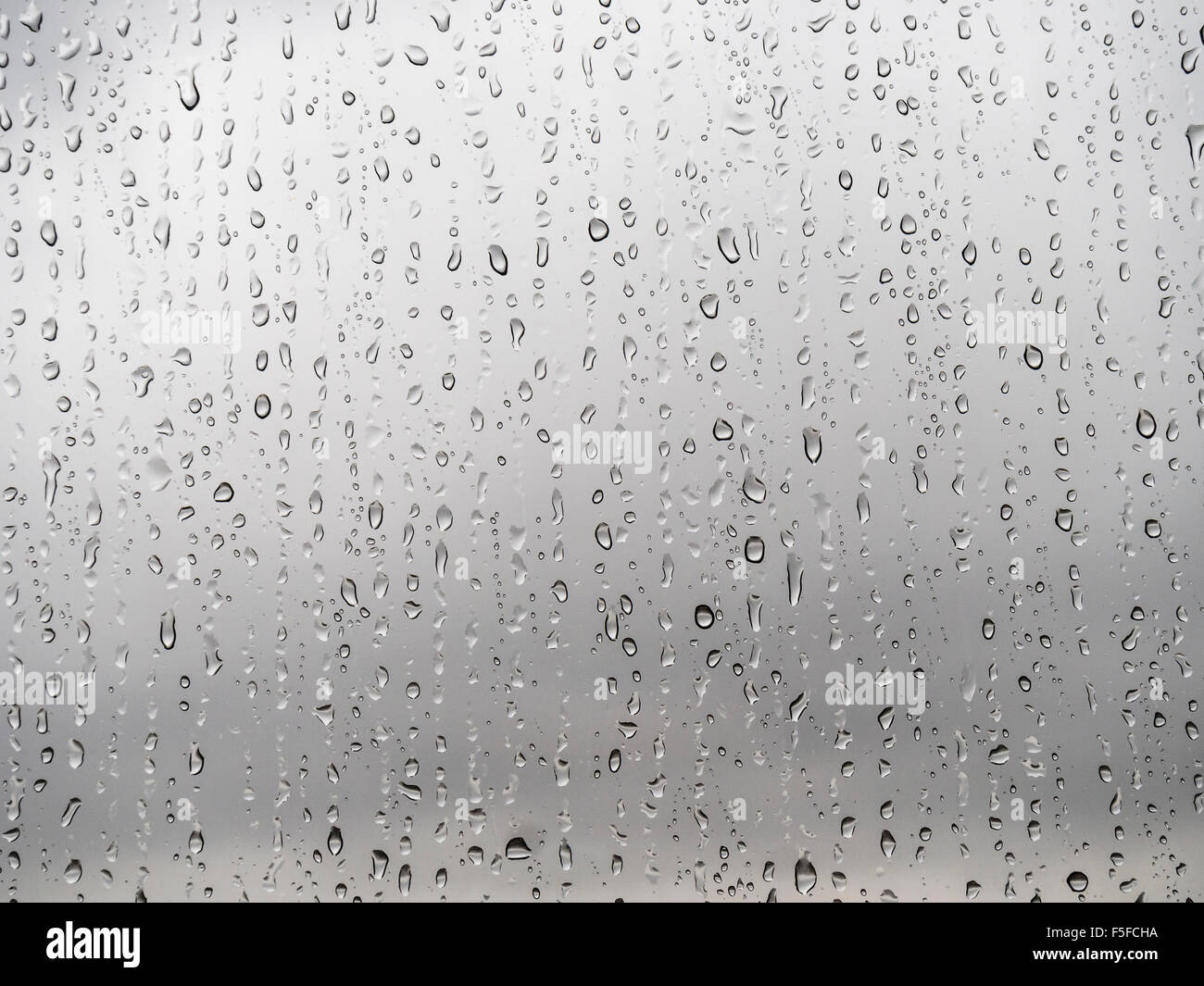Raindrops trickle down glass hi-res stock photography and images - Alamy