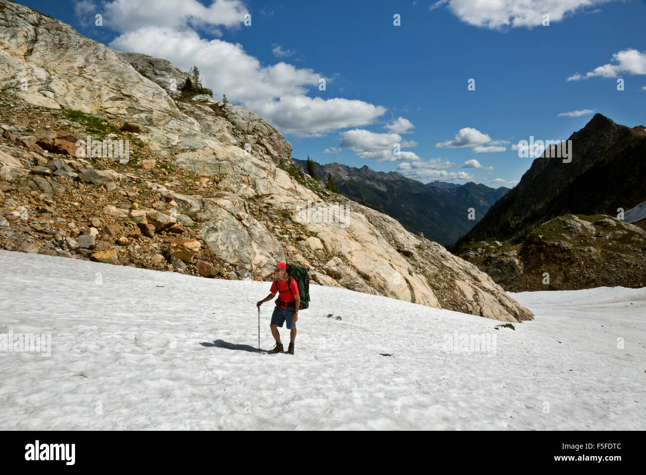 WASHINGTON - Hiker ascending the Spider Glacier in the Glacier Peak ...