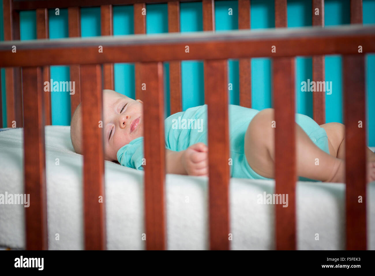 Adorable baby in his crib Stock Photo - Alamy
