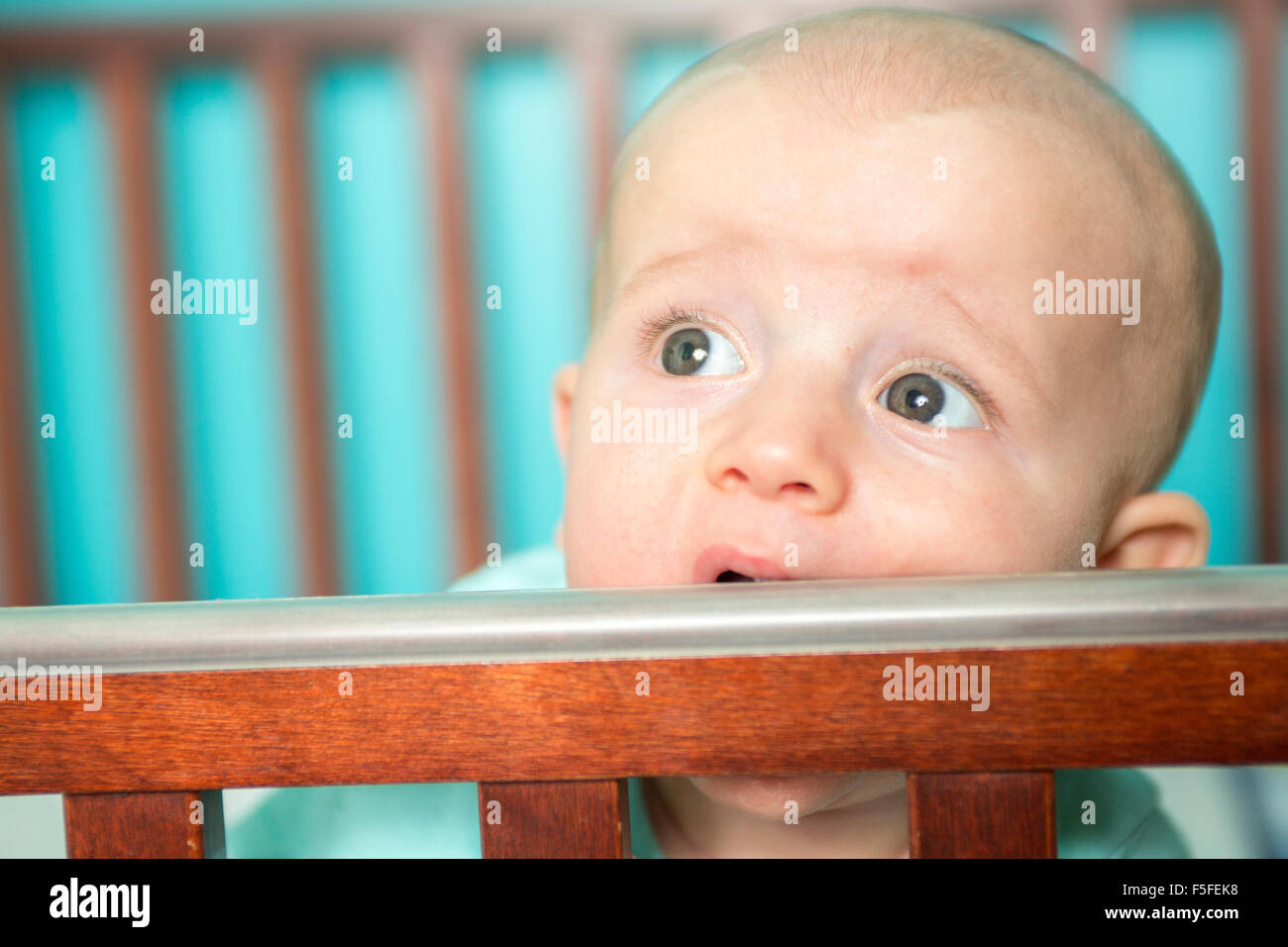 Adorable baby in his crib Stock Photo - Alamy
