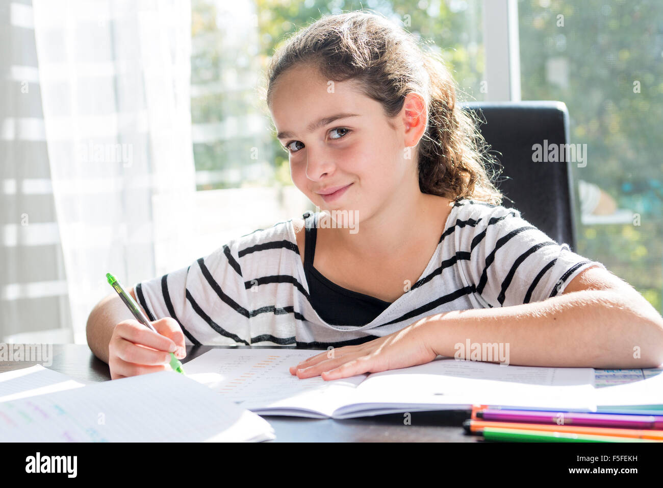 child doing his homework in the witchen table Stock Photo - Alamy