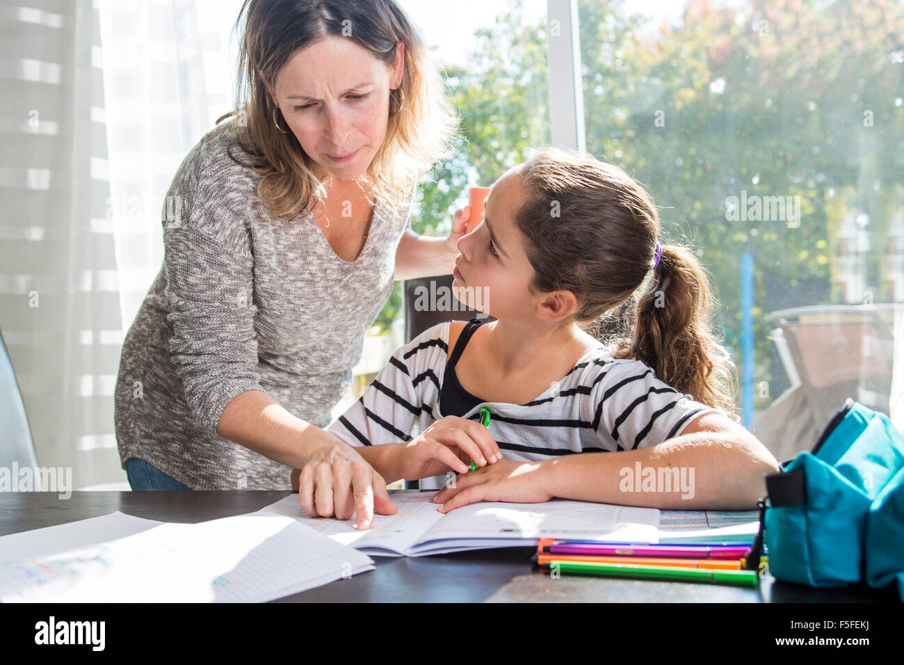 child doing his homework in the witchen table Stock Photo - Alamy