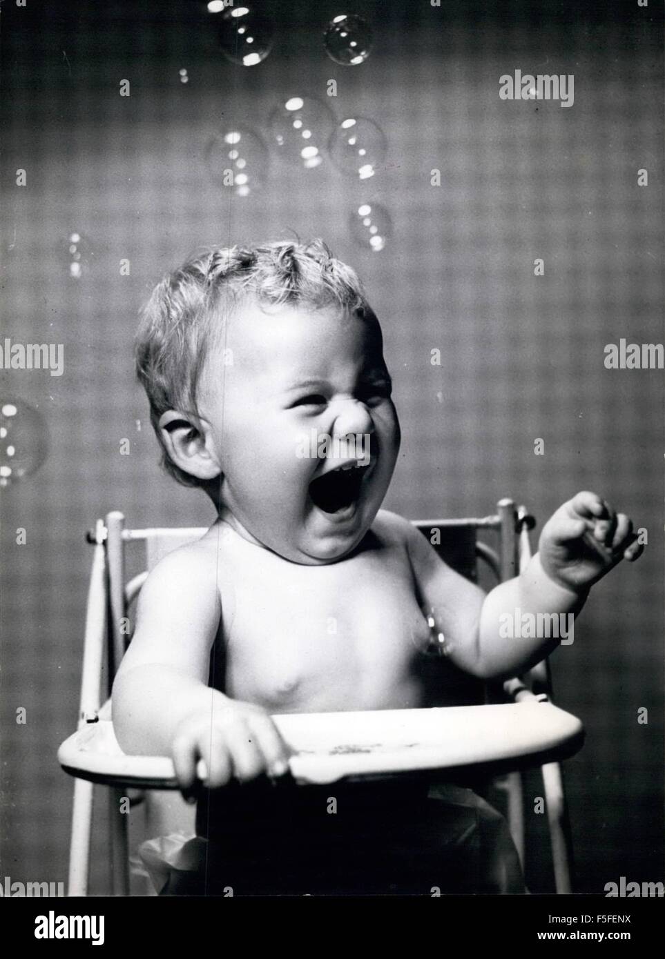 1967 - Susan roars with laughter, as the coloured bubbles float round ...