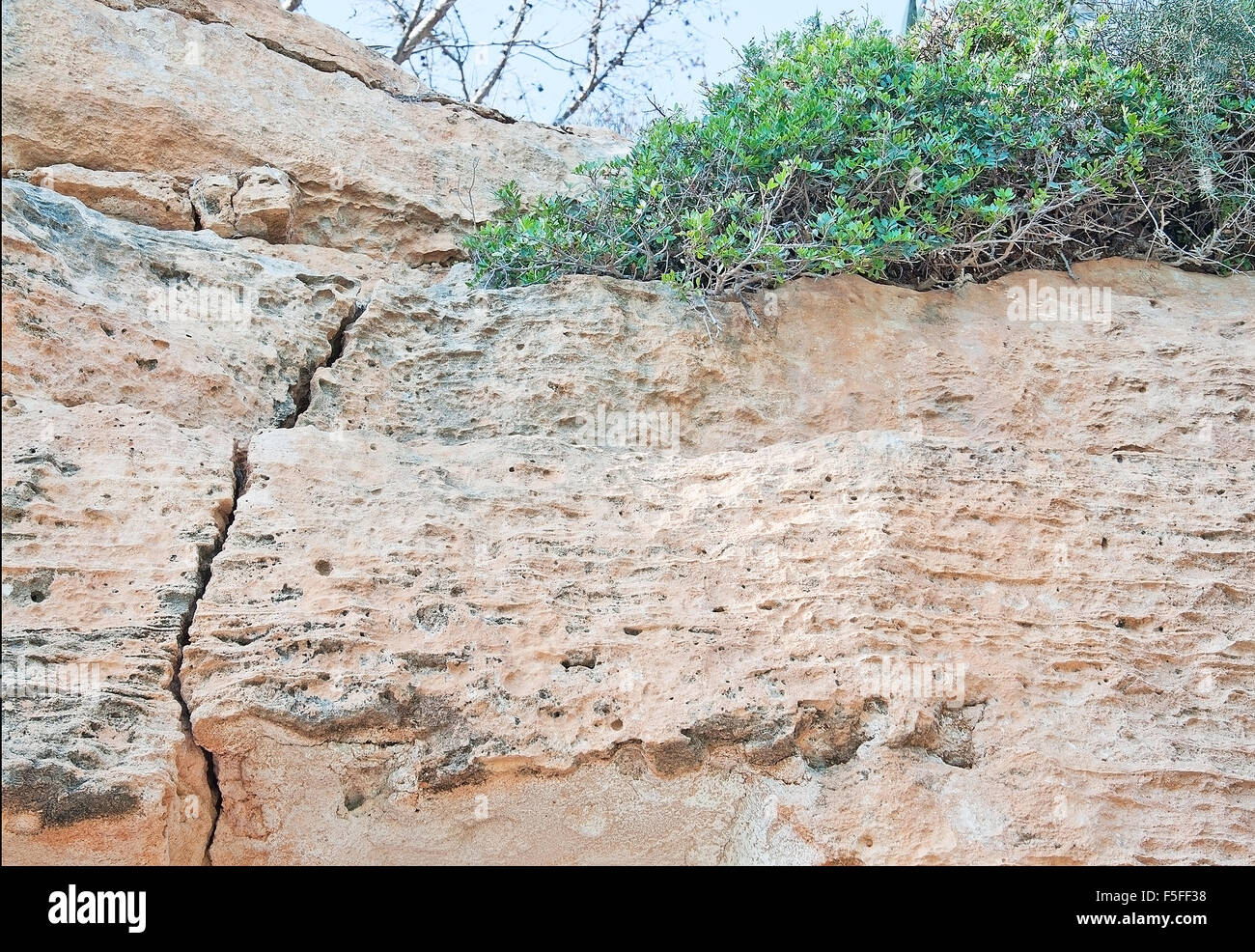 Massive limestone rock formation with cracks in Porto Cristo, Mallorca ...