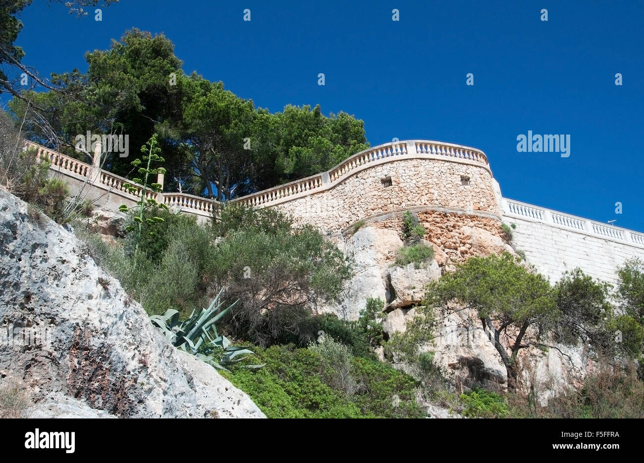 Fortress like building structure with wall in need of repair on a sunny ...