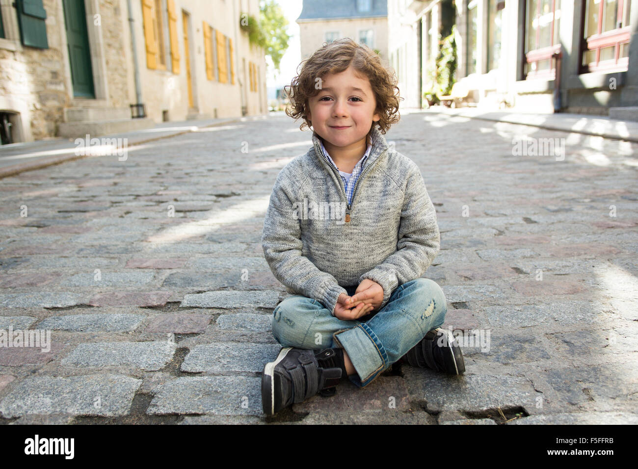 portrait of a boy on a urban background Stock Photo - Alamy