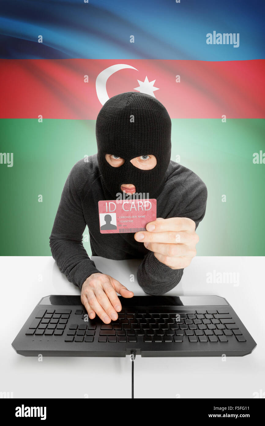 Hacker with ID card in hand and flag on background - Azerbaijan Stock ...