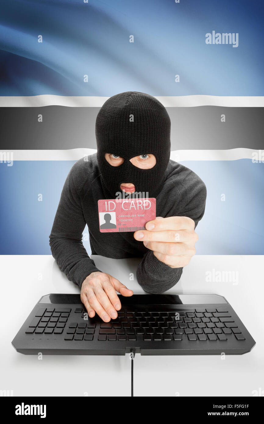 Hacker with ID card in hand and flag on background - Botswana Stock ...
