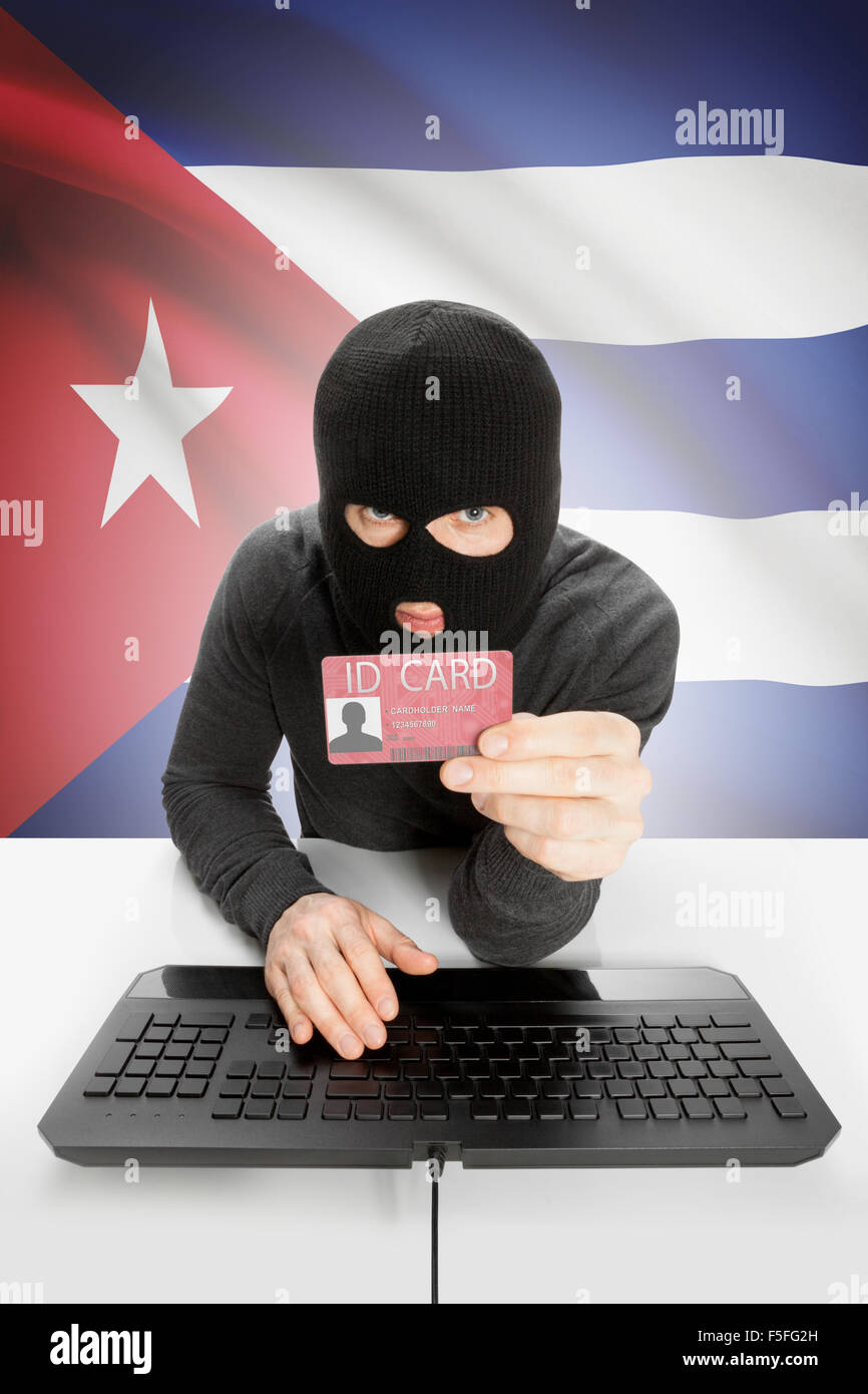 Hacker with ID card in hand and flag on background - Cuba Stock Photo ...