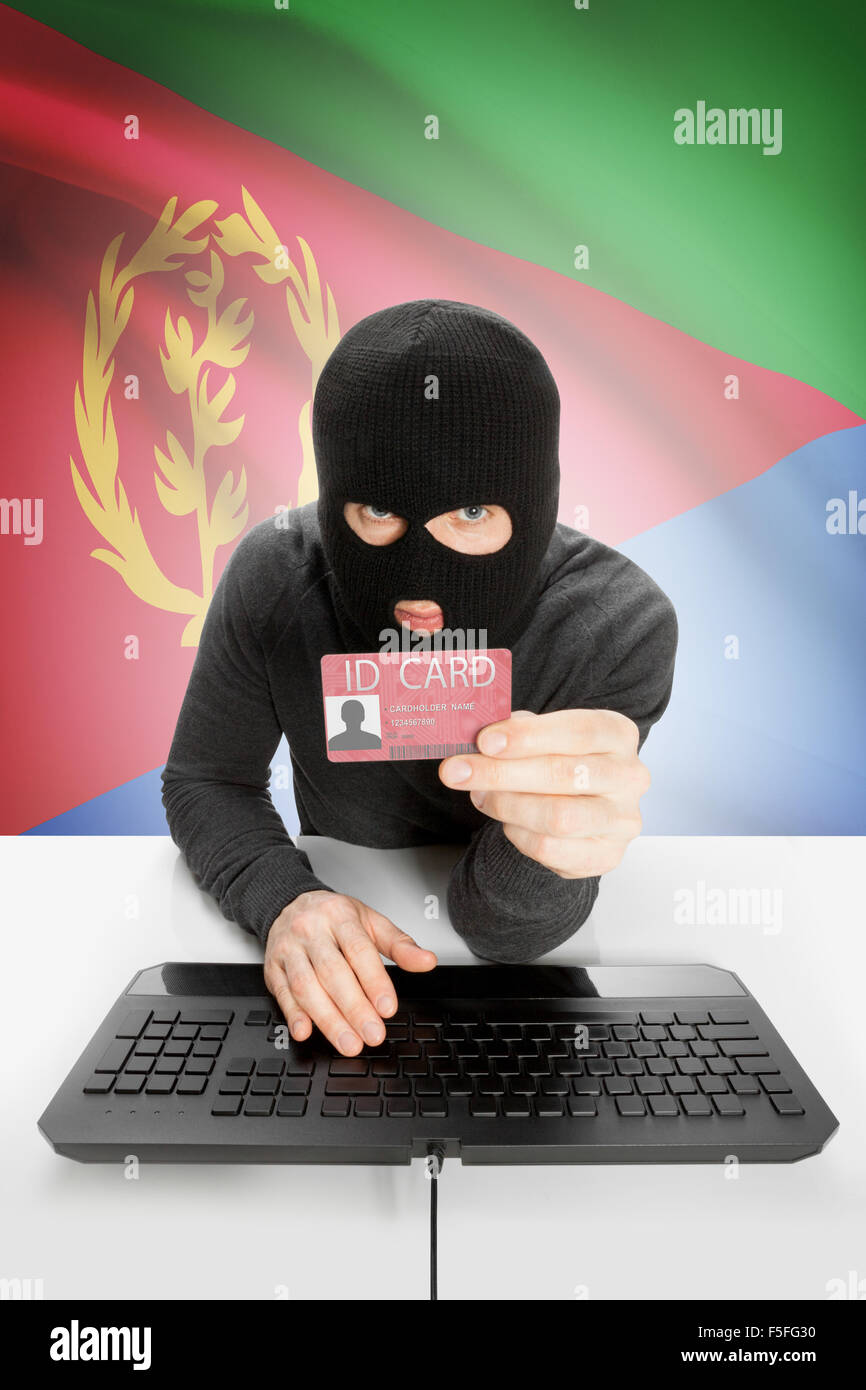 Hacker with ID card in hand and flag on background - Eritrea Stock ...