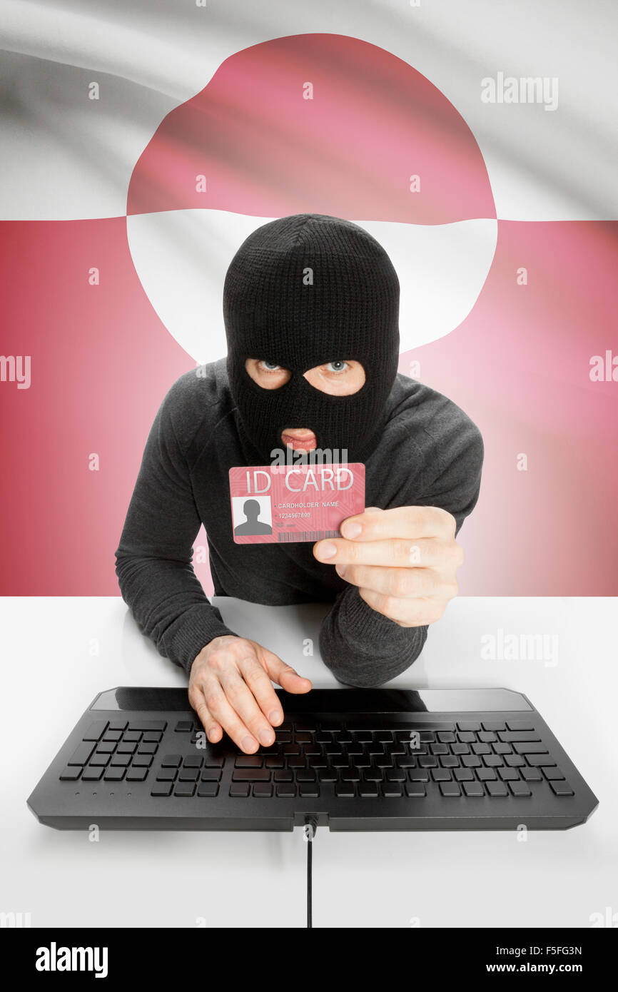 Hacker with ID card in hand and flag on background - Greenland Stock ...