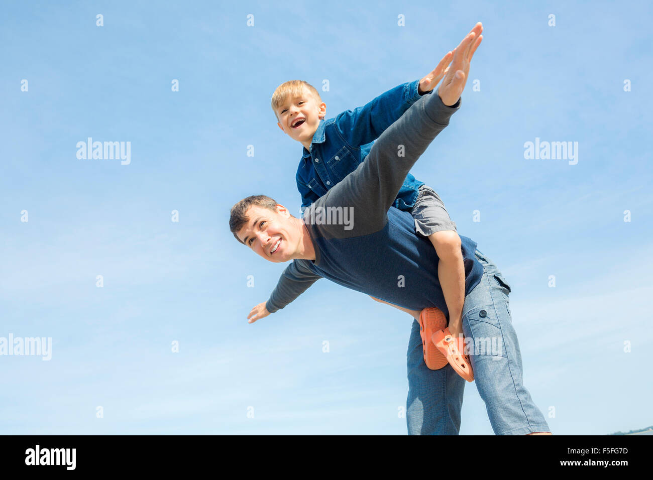 father play son side of the beach Stock Photo - Alamy