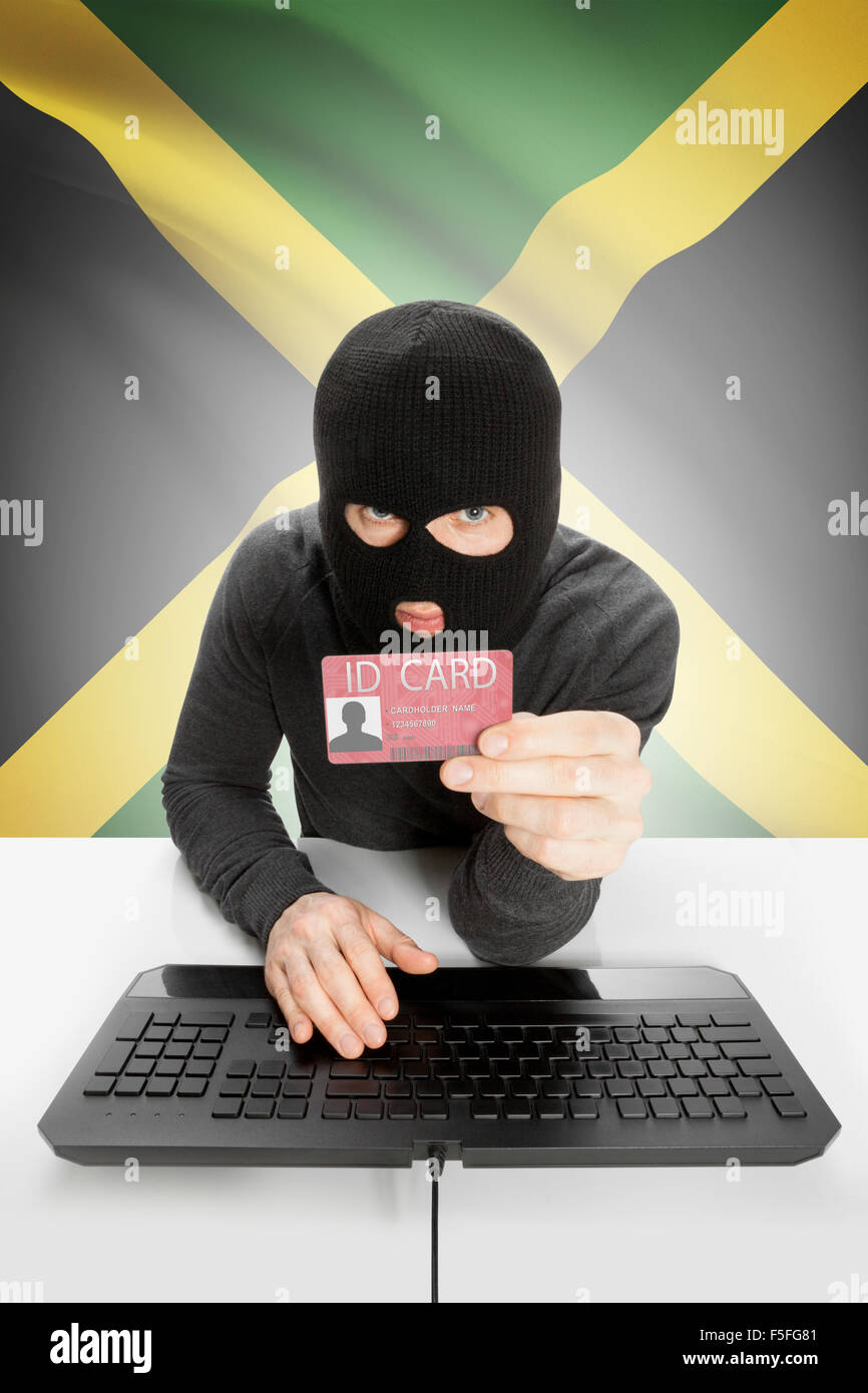 Hacker with ID card in hand and flag on background - Jamaica Stock ...