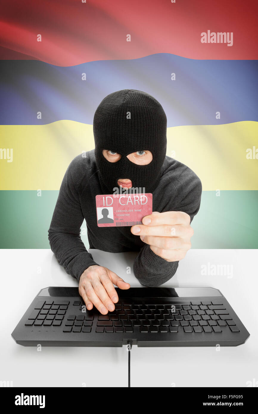 Hacker with ID card in hand and flag on background - Mauritius Stock ...