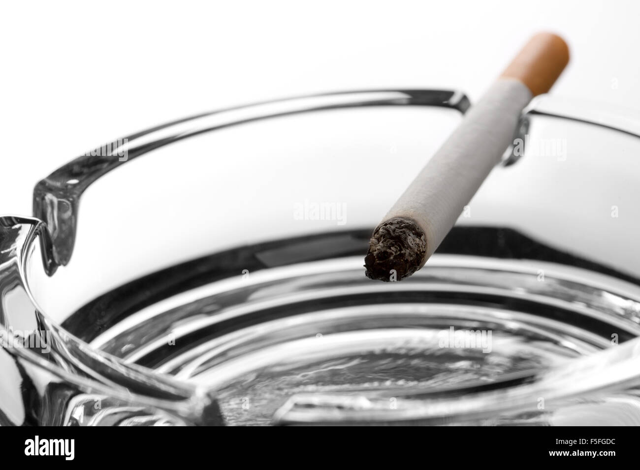 Cigarette on ashtray Stock Photo - Alamy
