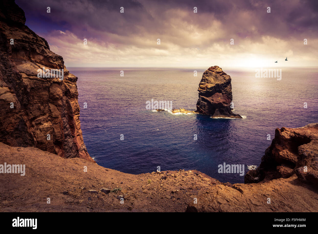 Cliff in the ocean Stock Photo - Alamy