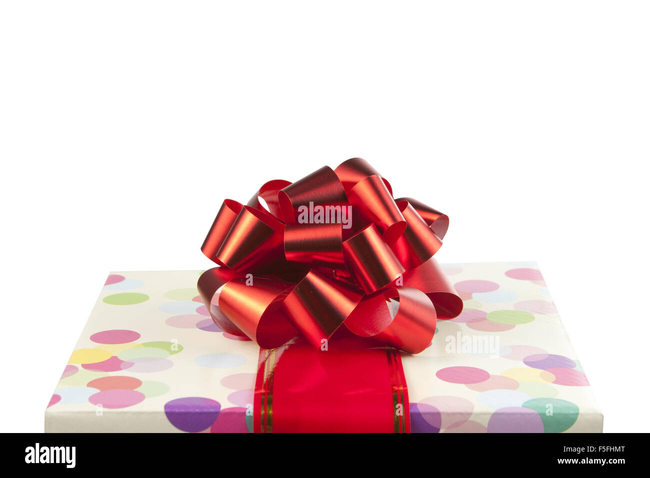 Gift with big red bow and ribbon Stock Photo - Alamy