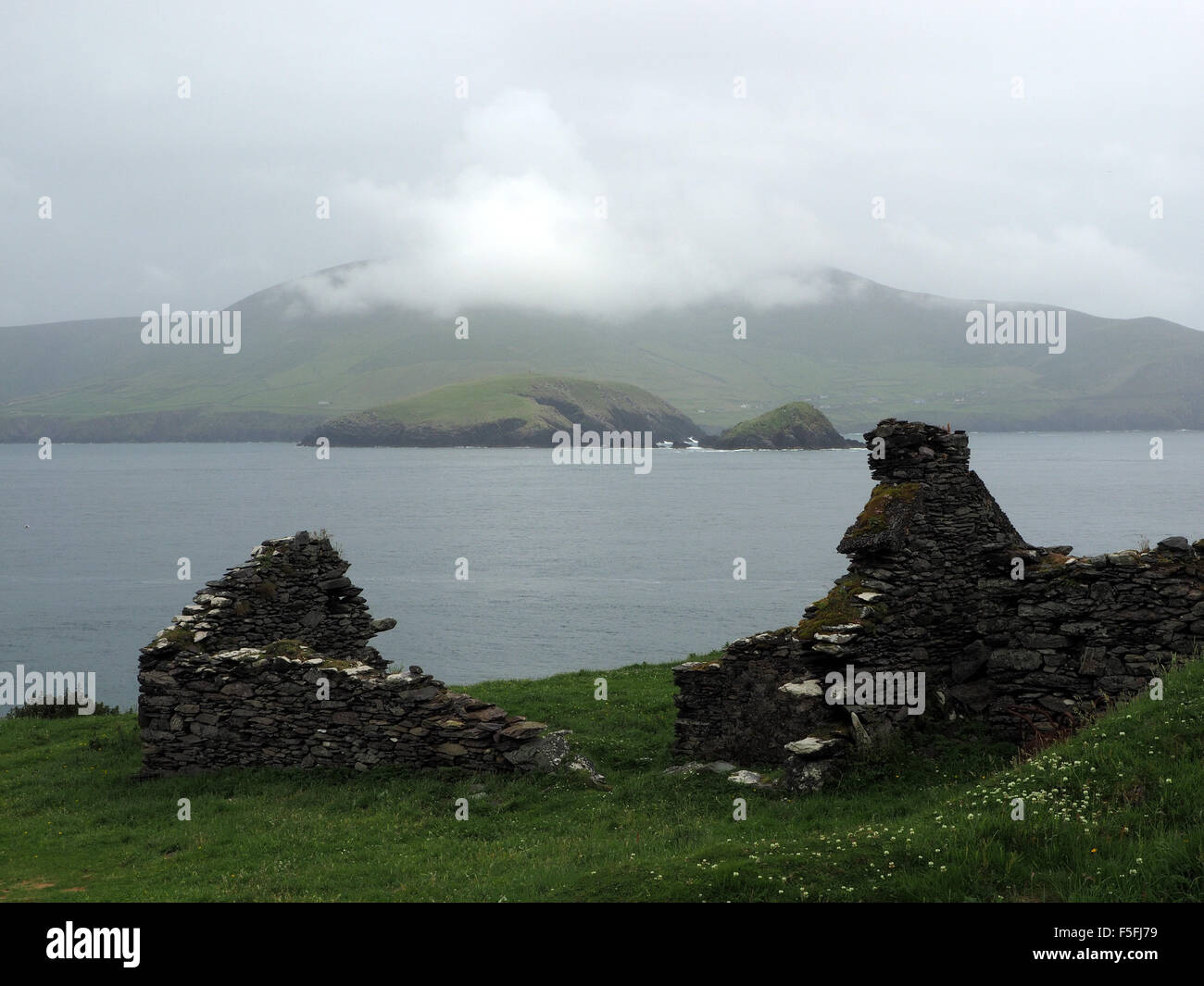 ruins of abandoned stone dwelling on Great Blasket Island, Ireland with ...