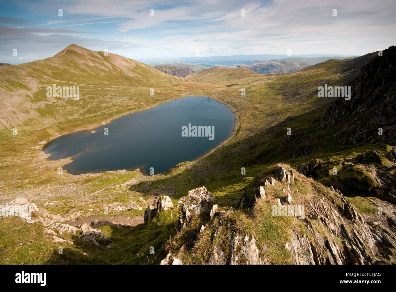 View of Red Tarn which sits below the knife edge ridge of Striding Edge ...