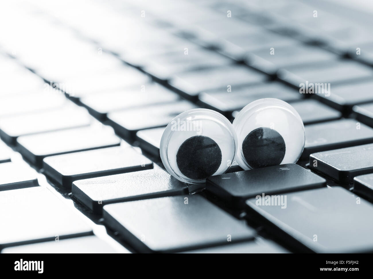 Laptop computer eyes symbol hi-res stock photography and images - Alamy