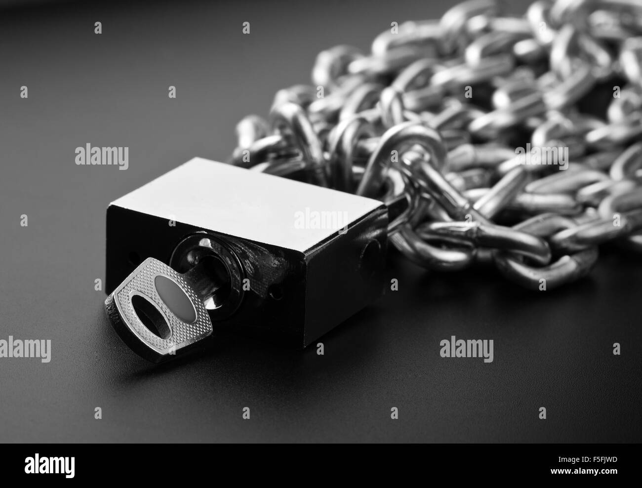 Key in padlock Stock Photo - Alamy