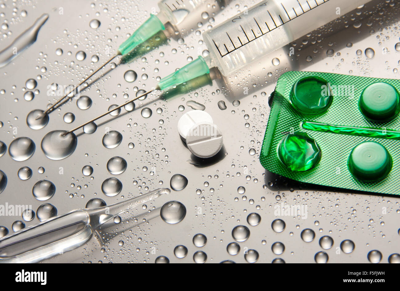 Medicine and syringes Stock Photo - Alamy