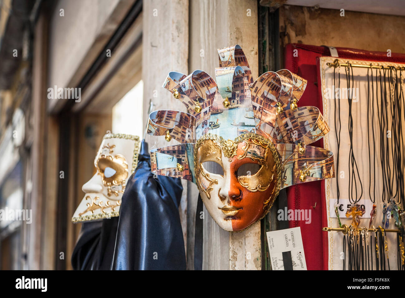 Colourful golden masks for Venice Carnival on display in a souvenir ...