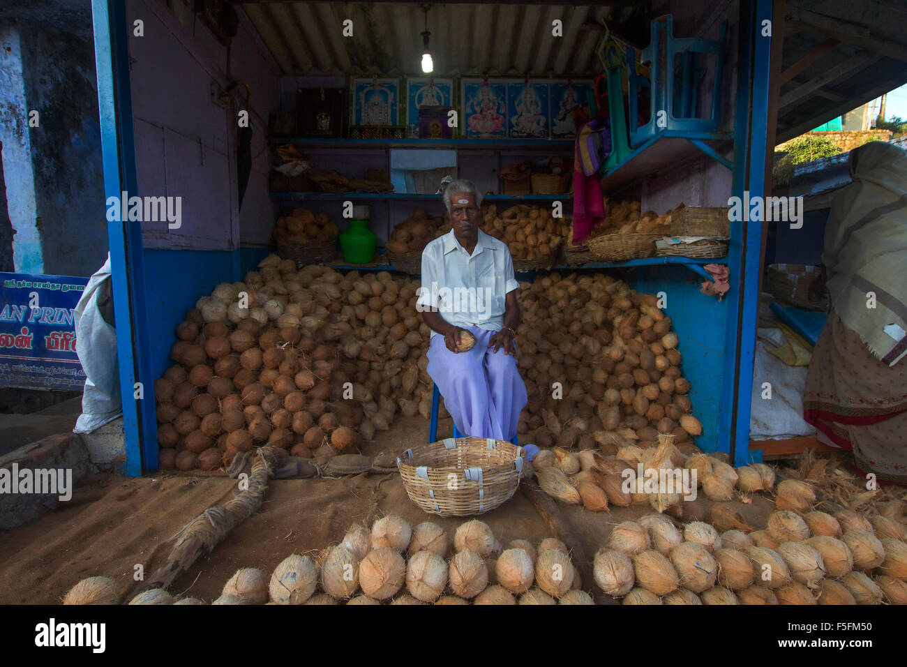 A coconut seller in market Stock Photo - Alamy